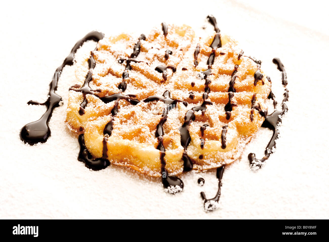 Waffle with chocolate sauce, close-up Stock Photo - Alamy
