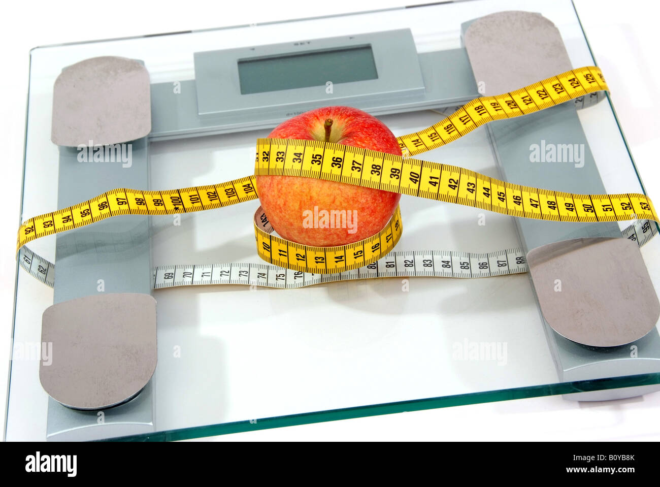 apple with tape measure on a scale Stock Photo - Alamy