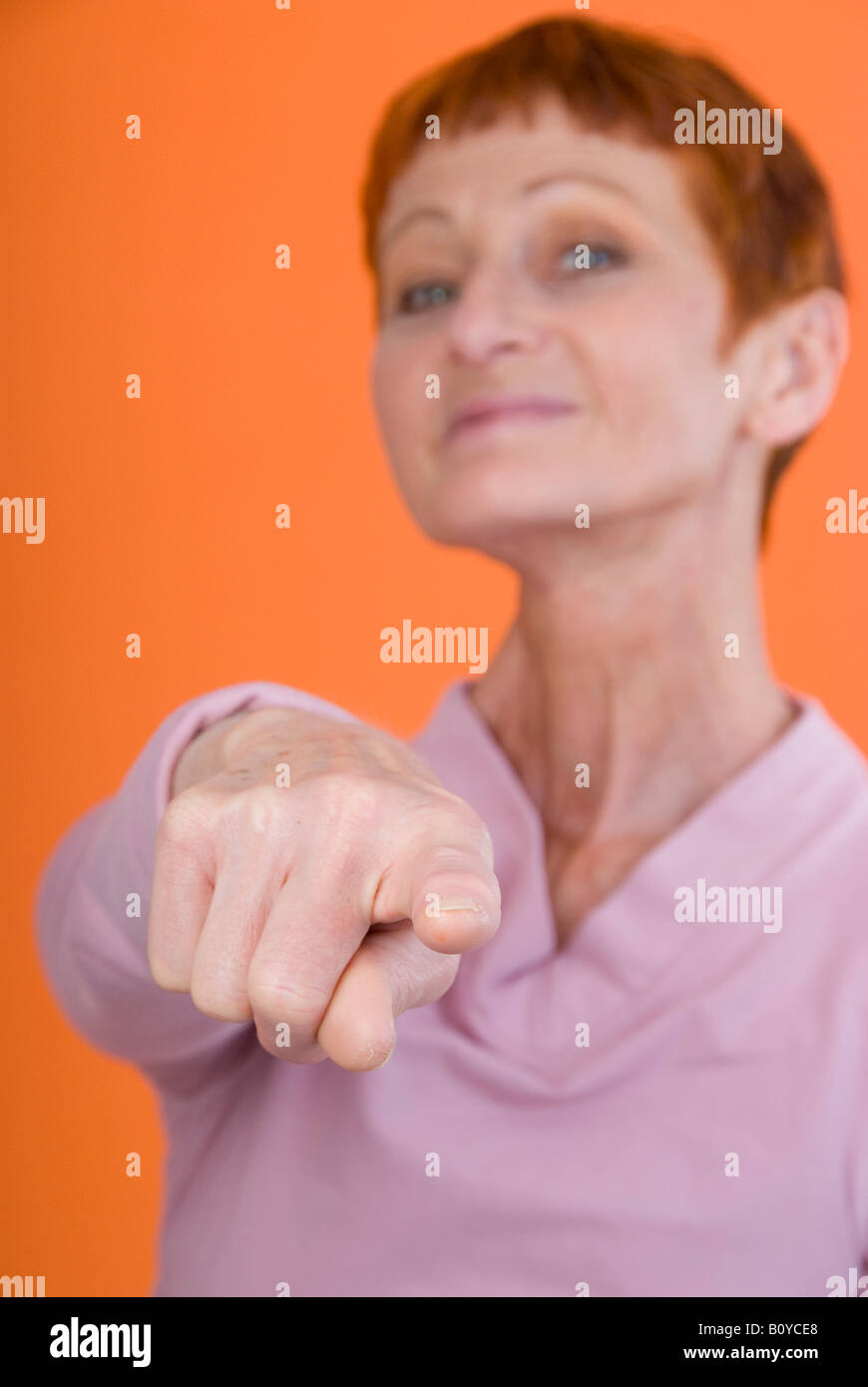 happy older woman, pointing with the finger to the camera Stock Photo ...