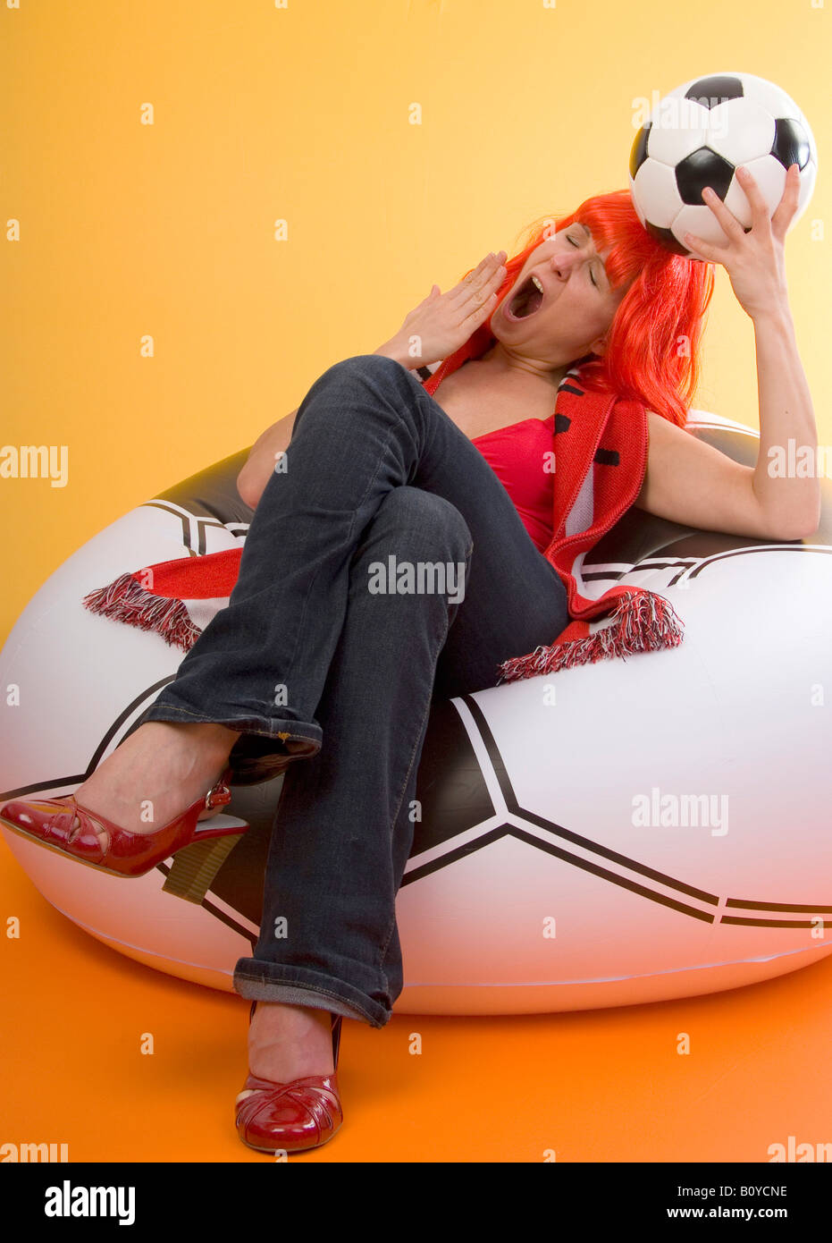 bored, female soccer fan Stock Photo - Alamy