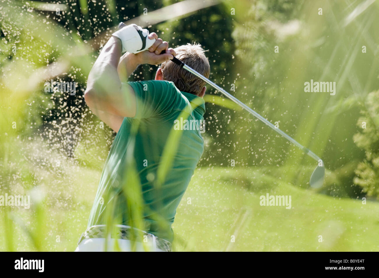 Golf player, rear view Stock Photo - Alamy