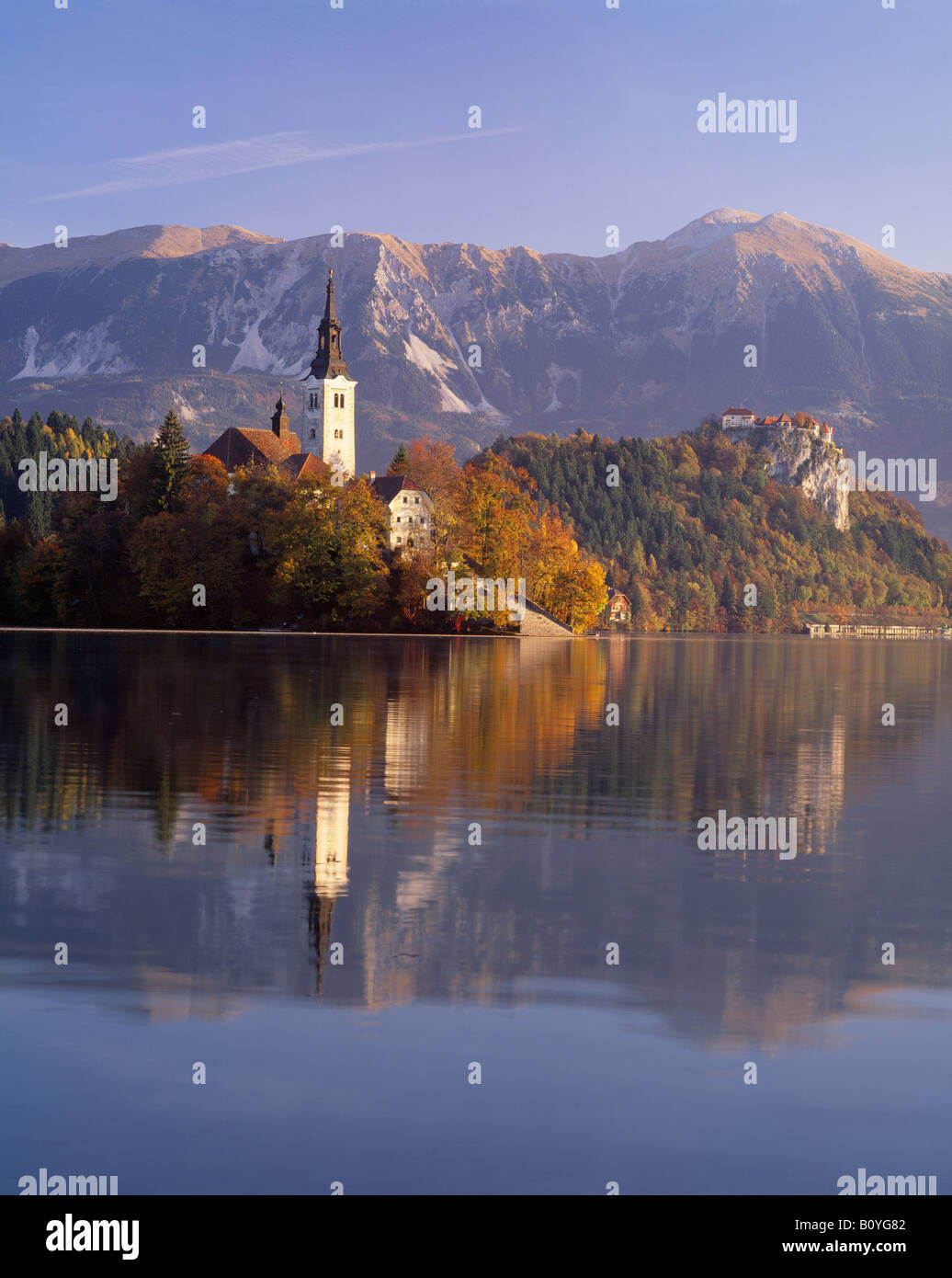 The Church of the Assumption on Blejski Otok with Bled Castle behind ...
