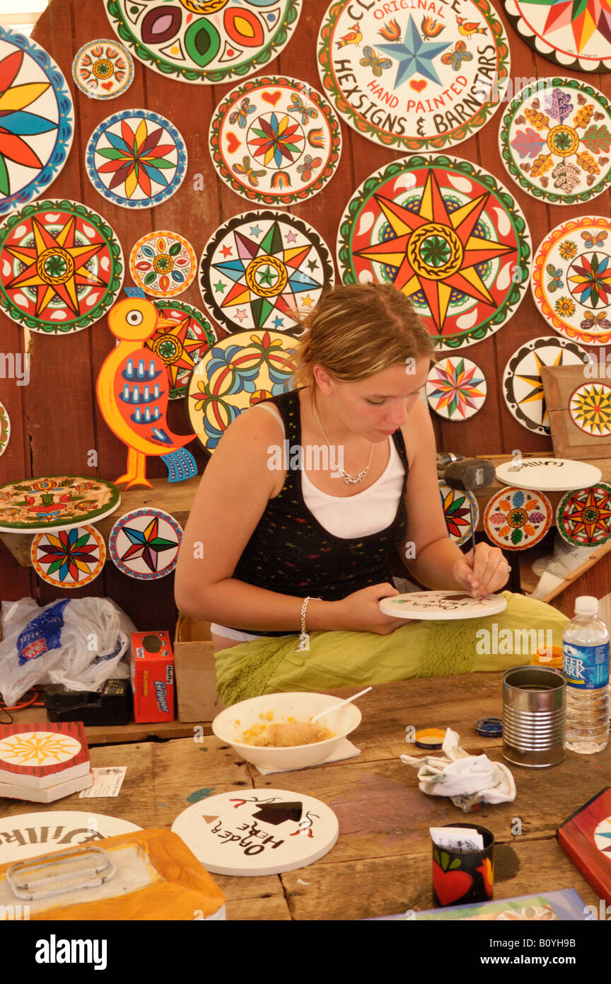 young woman artist creates hex signs and barnstars Stock Photo - Alamy