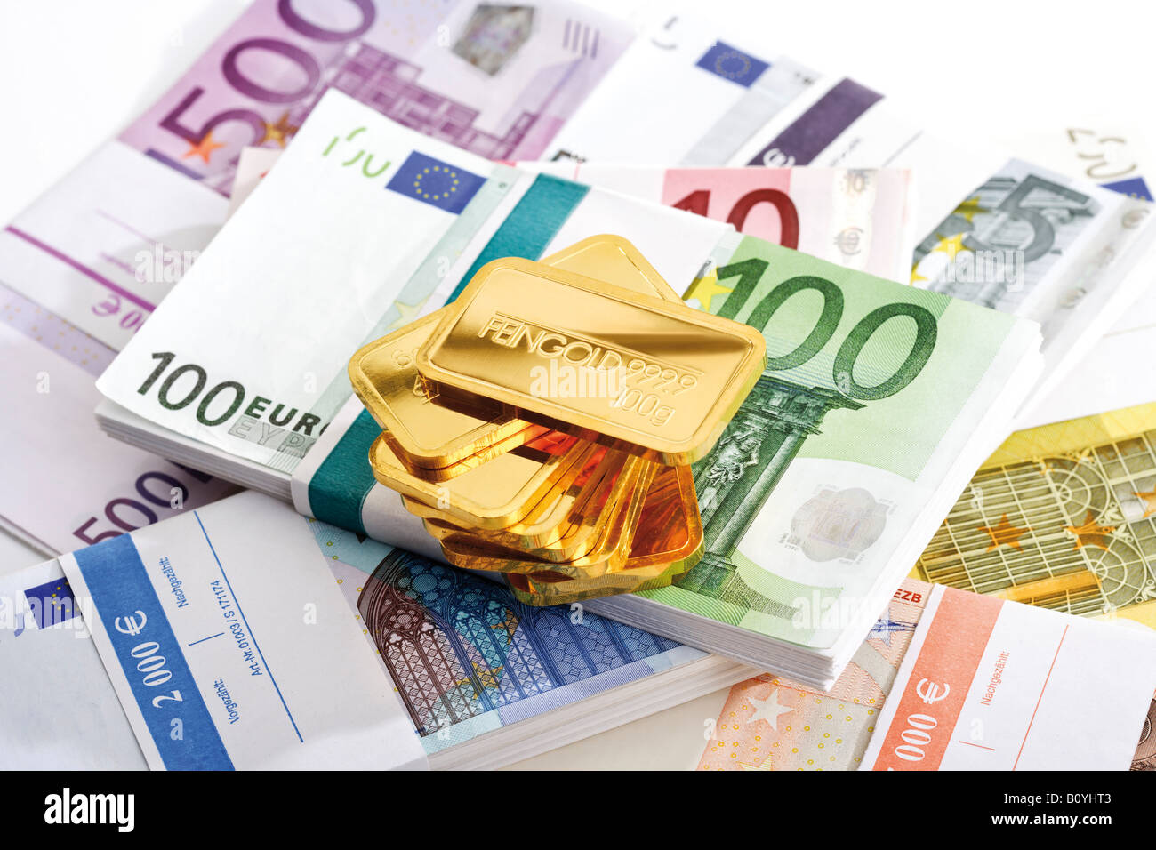 Gold bars and euro notes Stock Photo - Alamy