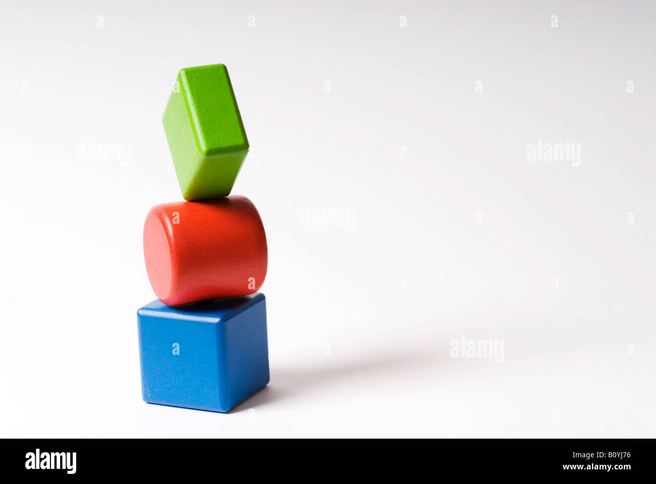 Stock photo of three childrens building blocks balanced in a most ...