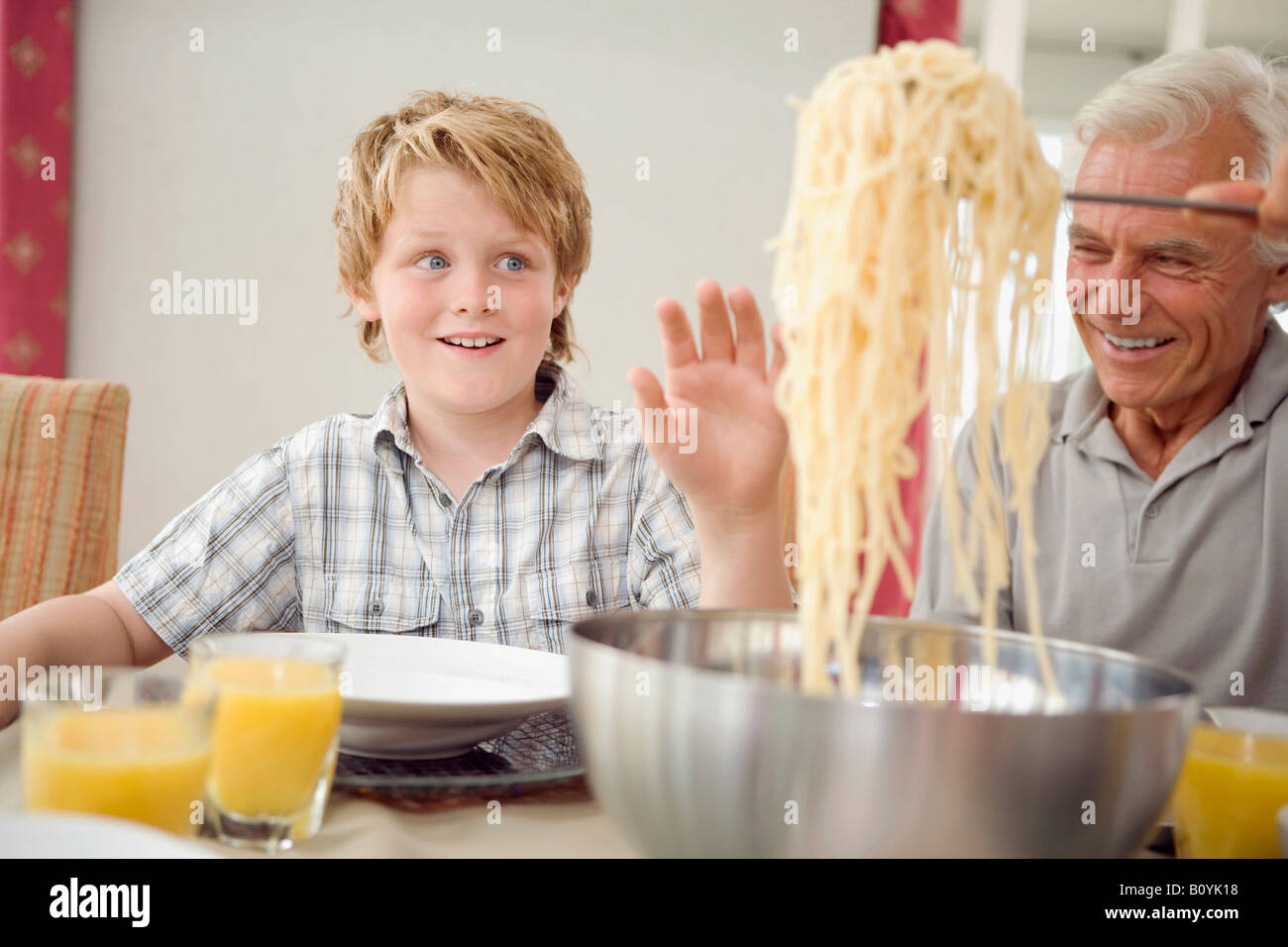 Family taking lunch at home Stock Photo - Alamy