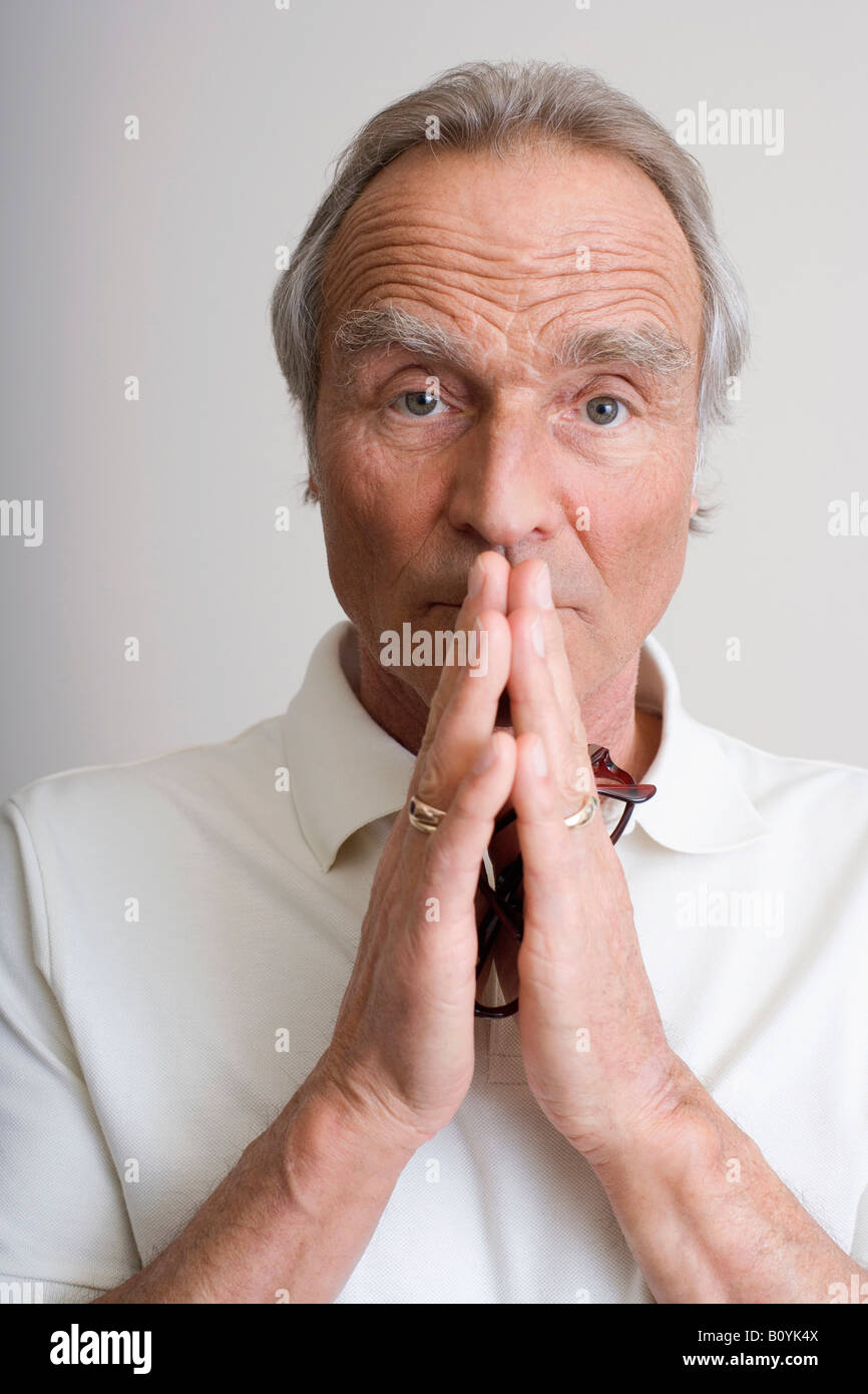 Senior man, folded hands, portrait Stock Photo - Alamy Senior man, folded hands, portrait Stock Photo - Alamy