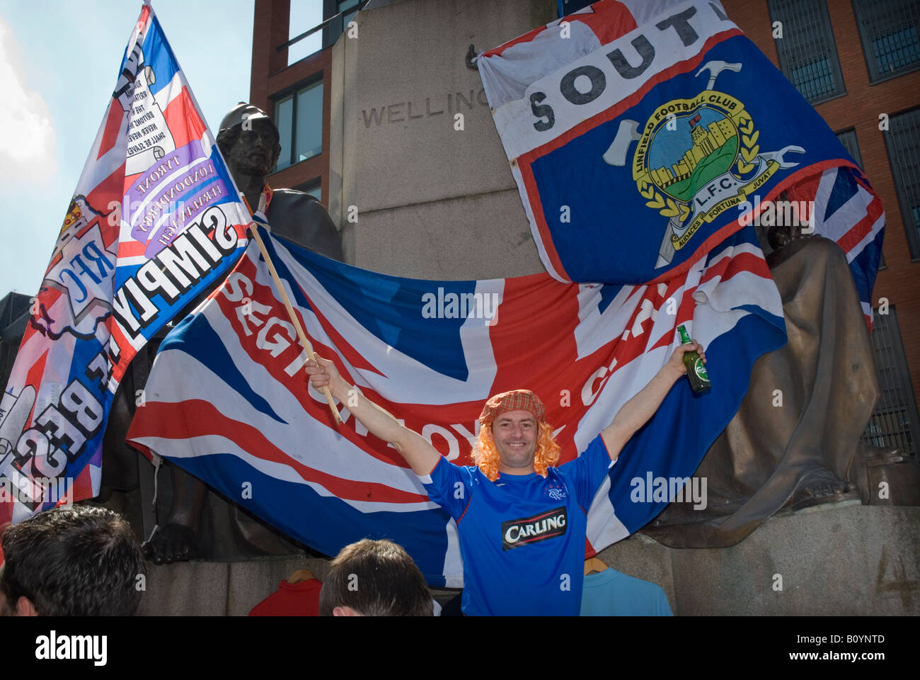 A Glasgow Rangers fan waving a large Union Jack on the morning of the ...