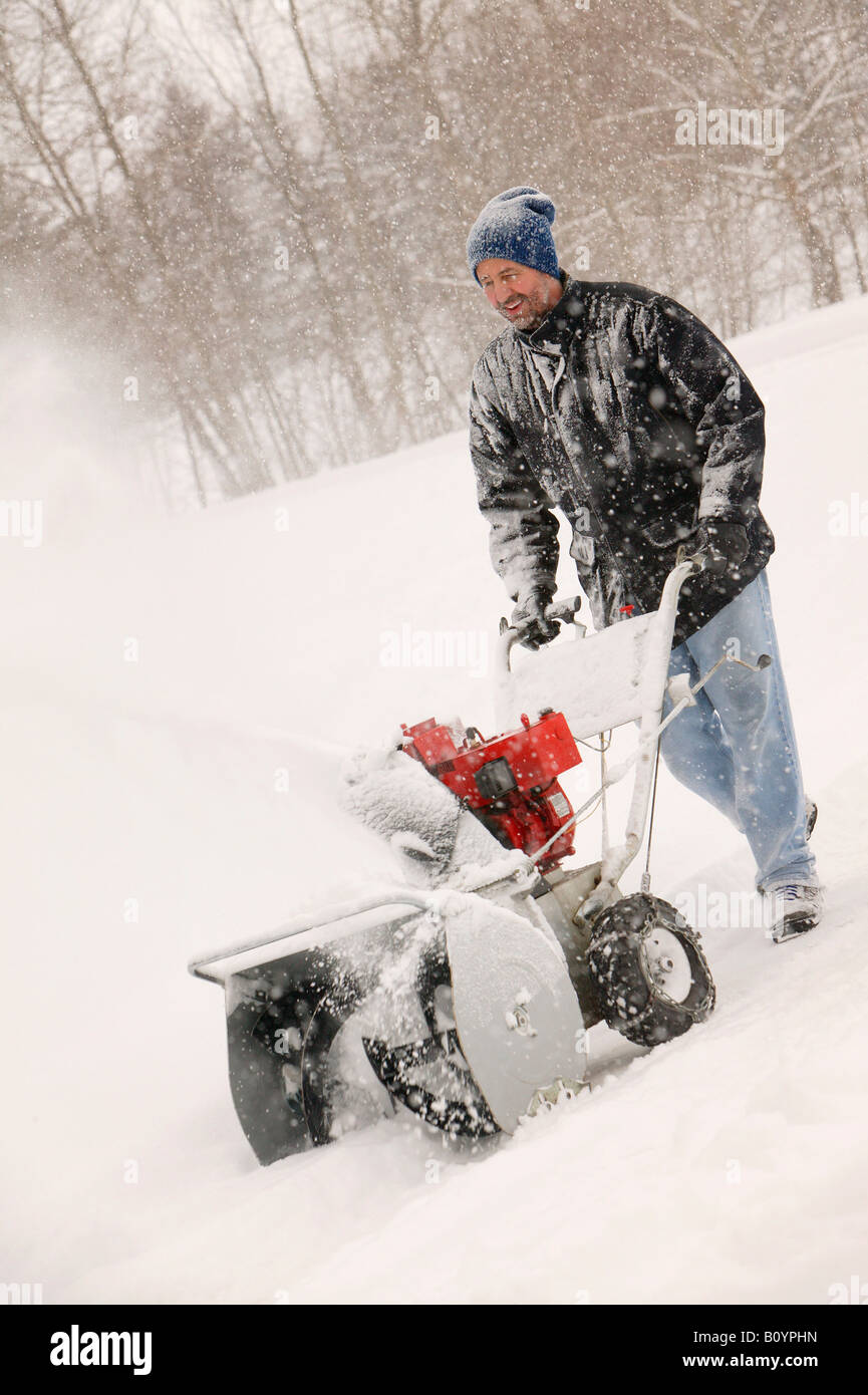 A man snow-blowing Stock Photo - Alamy