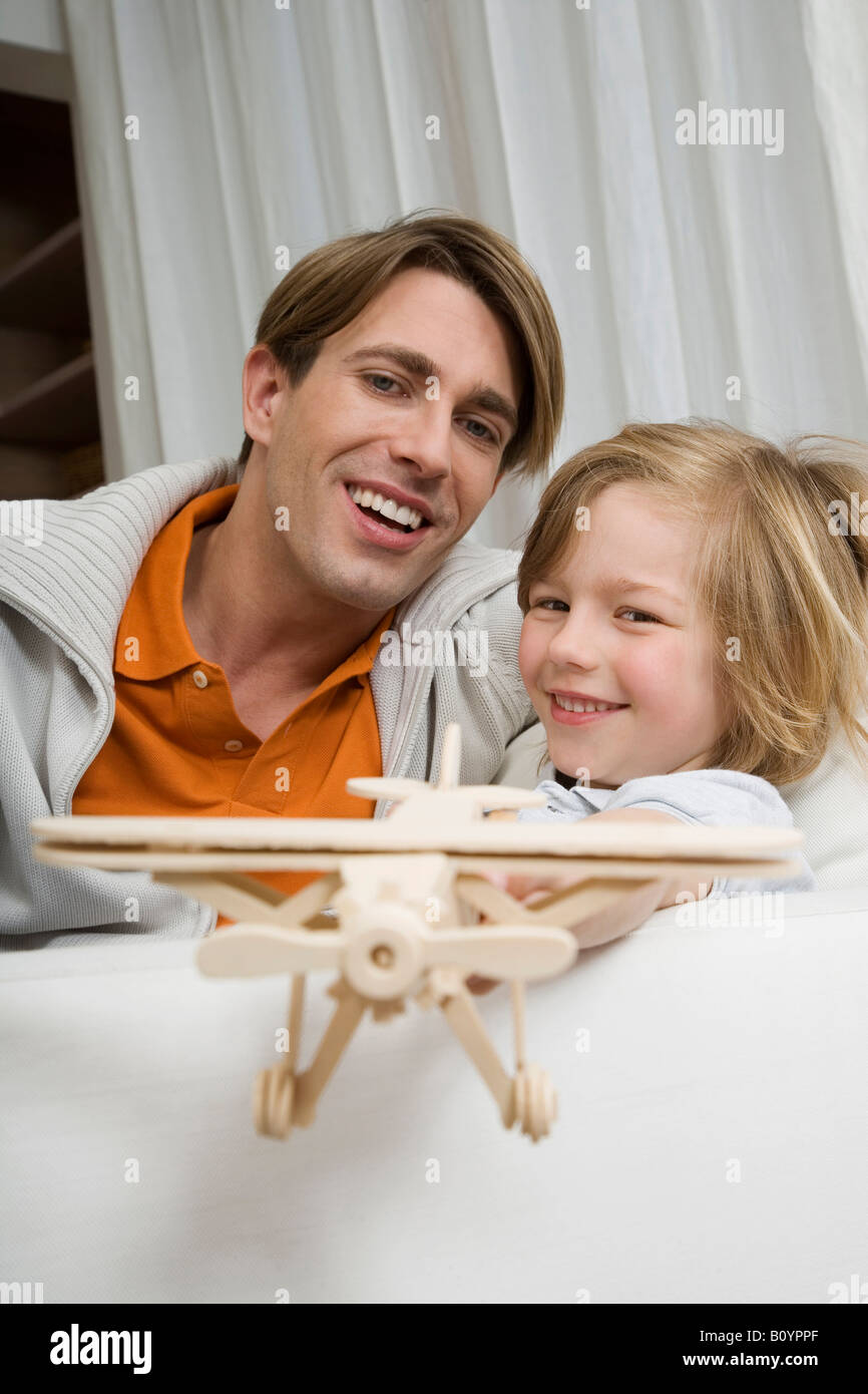 Son showing model airplane hi-res stock photography and images - Alamy