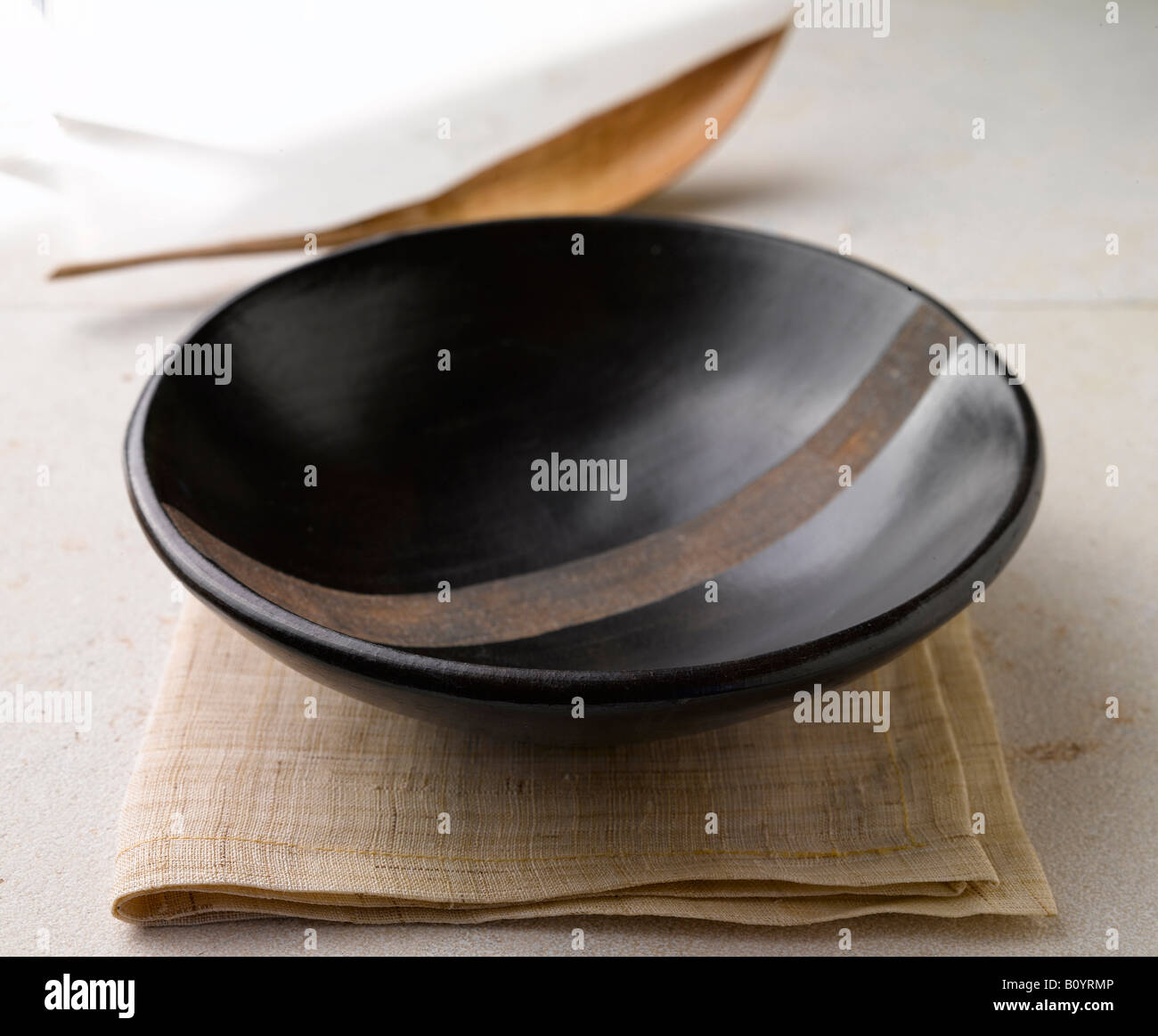 Wooden bowl on napkin Stock Photo - Alamy