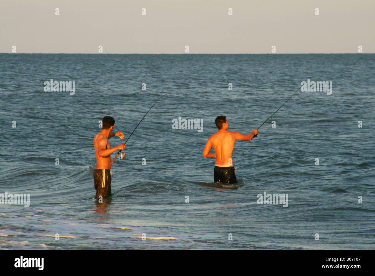 Twin brothers fishing in the Gulf of Mexico, Florida Stock Photo - Alamy