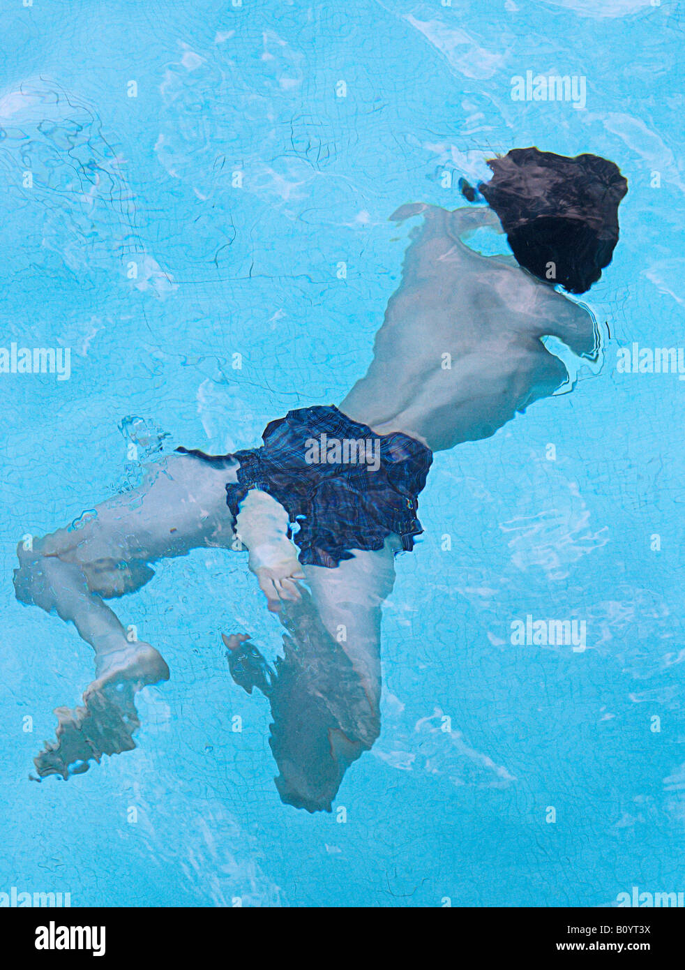 Boy swimming in a swimming pool Stock Photo - Alamy