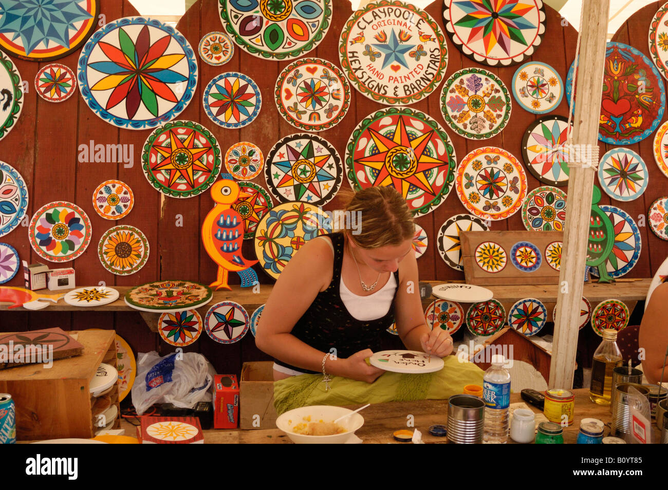 young woman artist creates hex signs and barnstars Stock Photo - Alamy