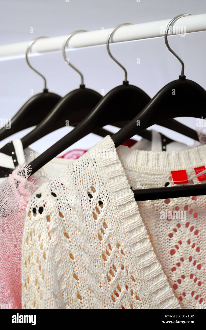 Women s clothing on a rack on black hangers Stock Photo - Alamy