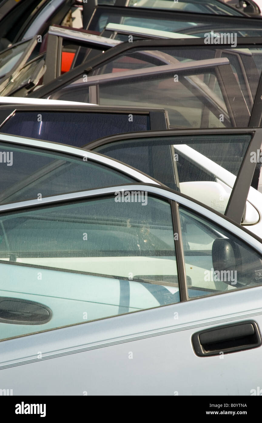 Smashed and crushed automobiles and parts in an Auto Salvage yard Stock ...