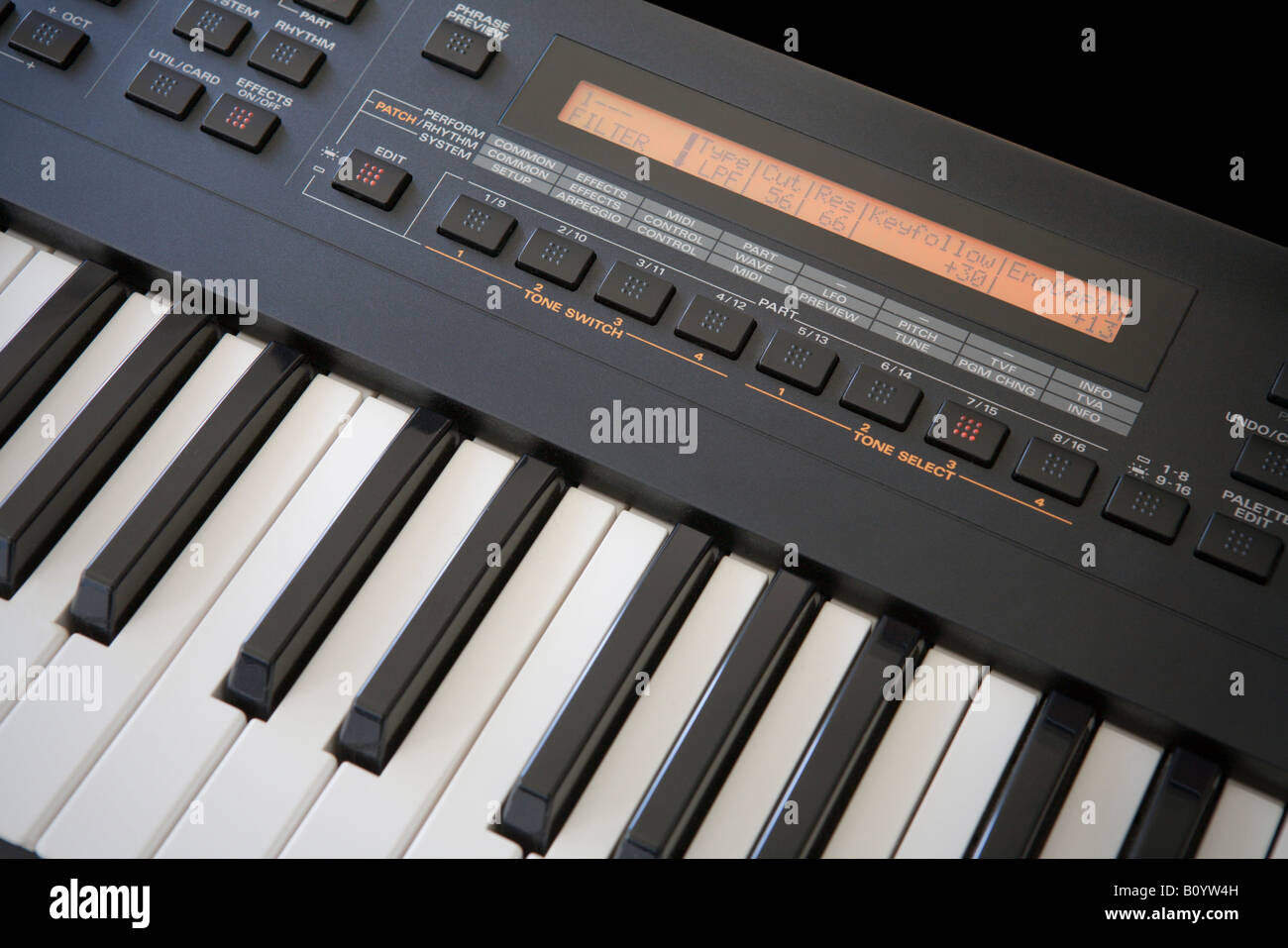 Digital synthesizer with keyboard LCD screen showing program ...