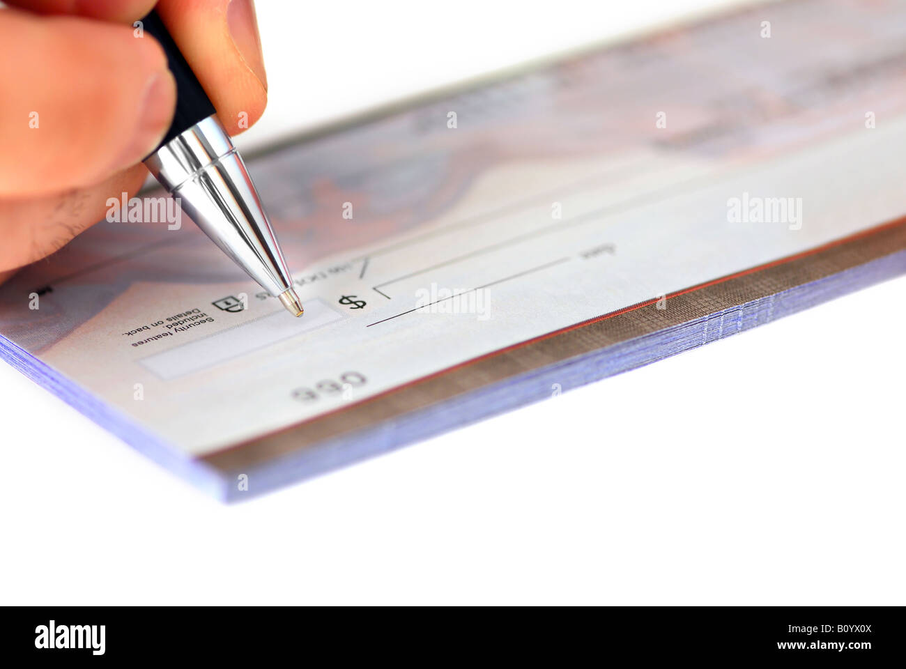 Closeup of man s hand writing a cheque Stock Photo - Alamy
