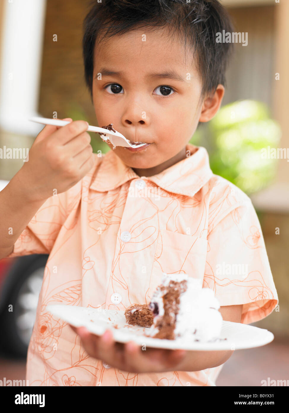 boy eating cake Stock Photo - Alamy
