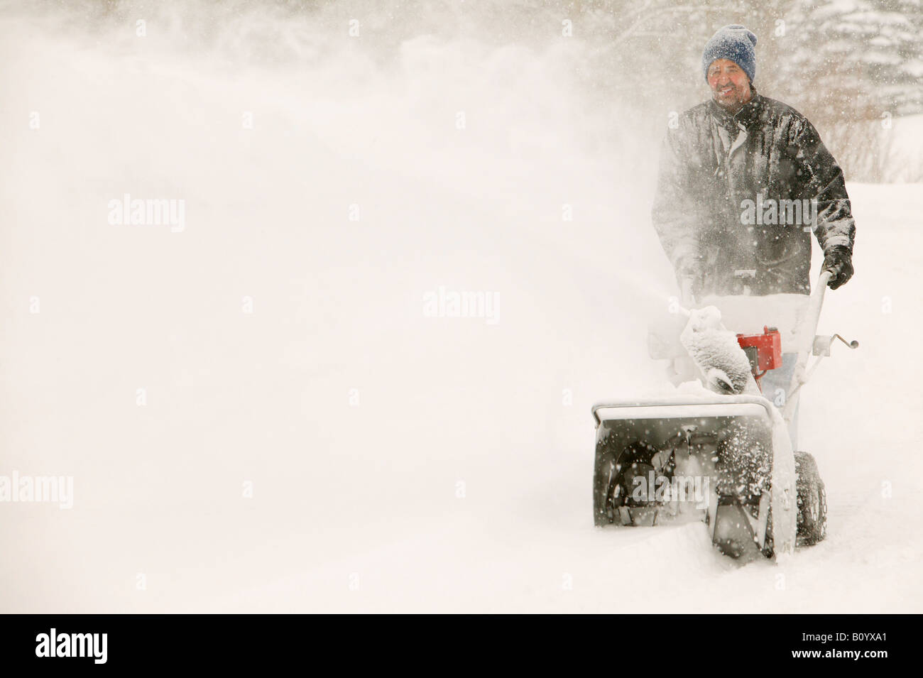 Man snowblowing hi-res stock photography and images - Alamy