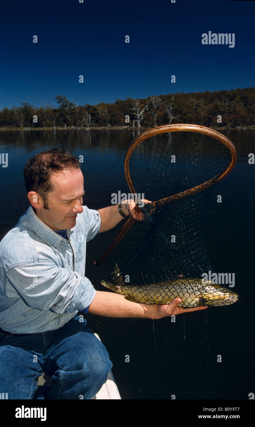 Man fishing from dinghy hi-res stock photography and images - Alamy