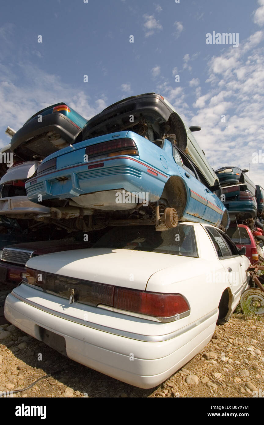 Smashed and crushed automobiles and parts in an Auto Salvage yard Stock ...