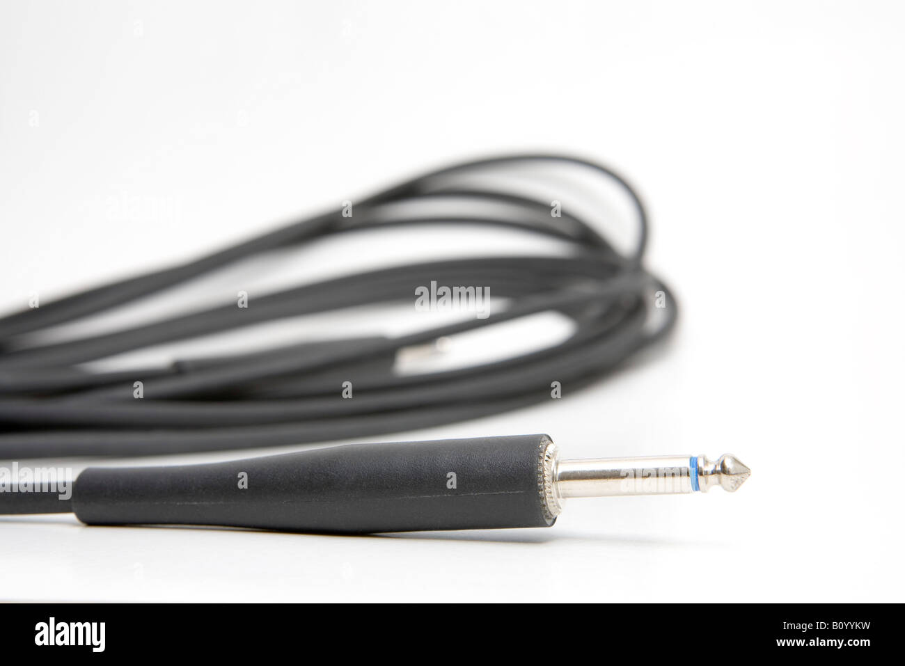 Guitar cable over white Stock Photo - Alamy