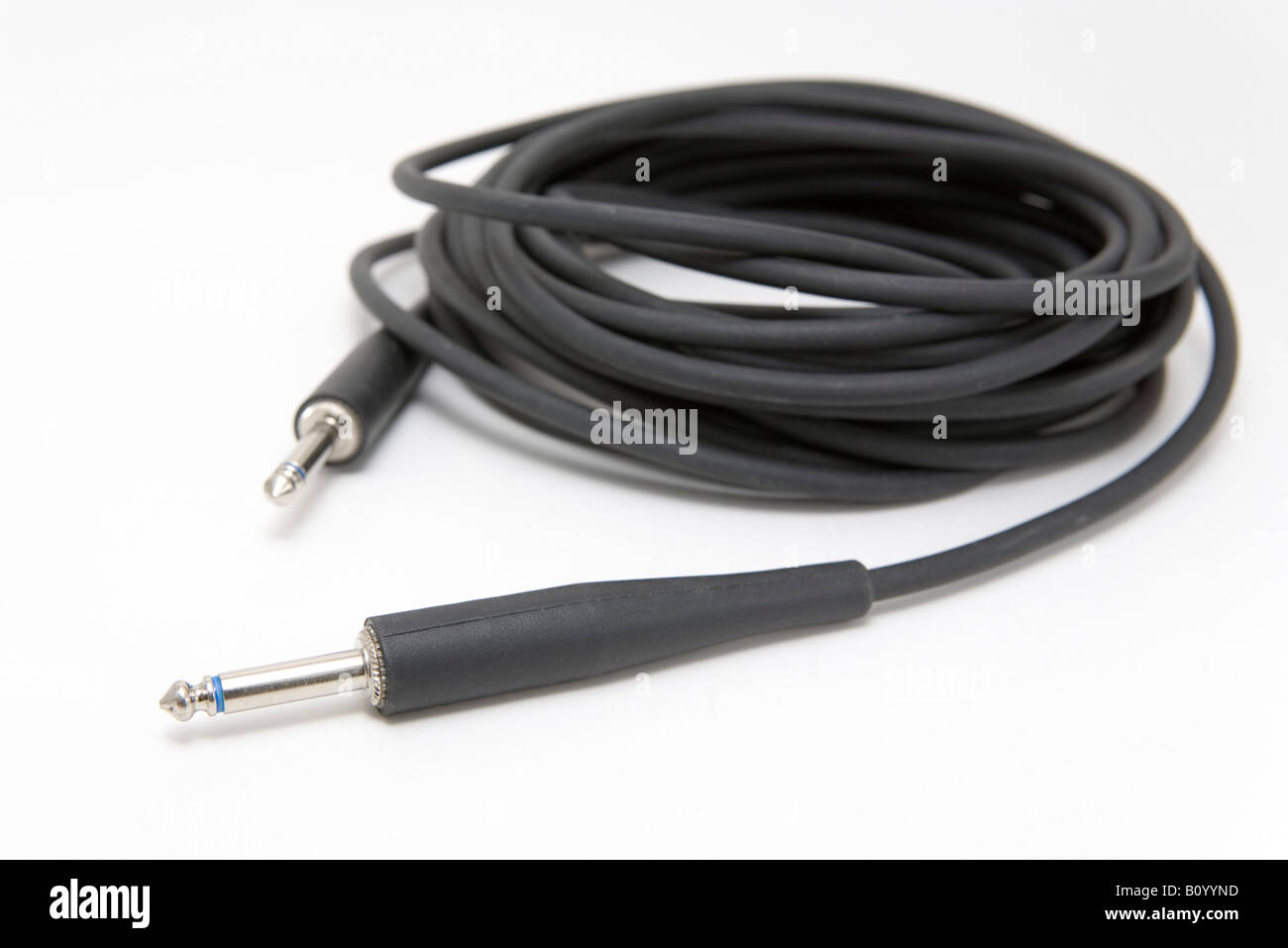 Guitar cable over white Stock Photo - Alamy
