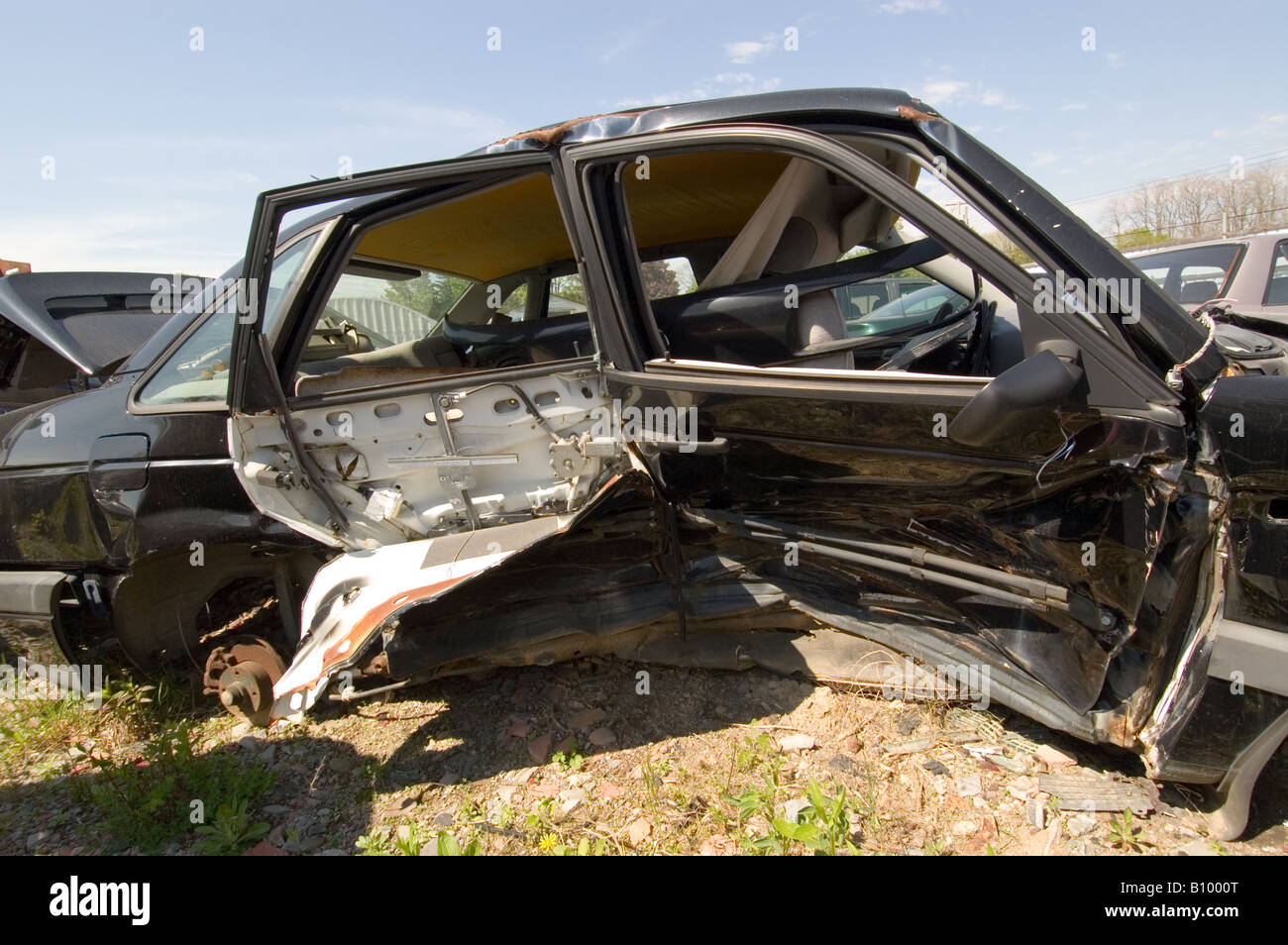 Smashed and crushed automobiles and parts in an Auto Salvage yard Stock ...