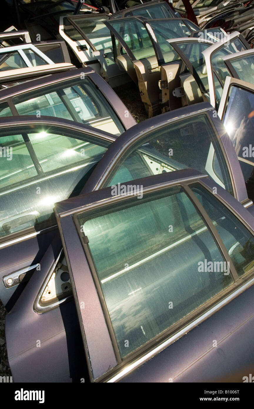 Smashed and crushed automobiles and parts in an Auto Salvage yard Stock ...