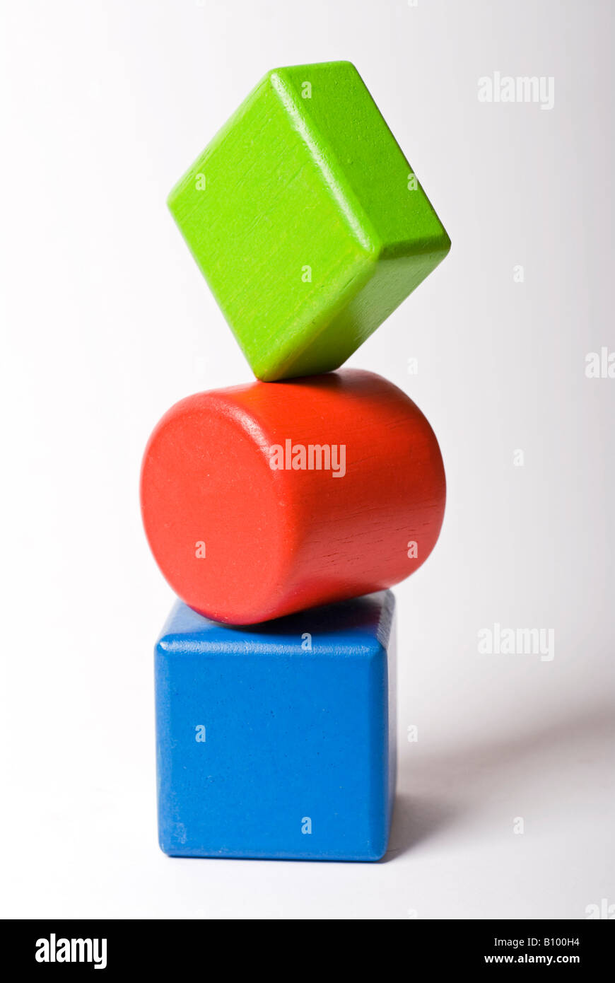Stock photo of three childrens building blocks balanced in a most ...