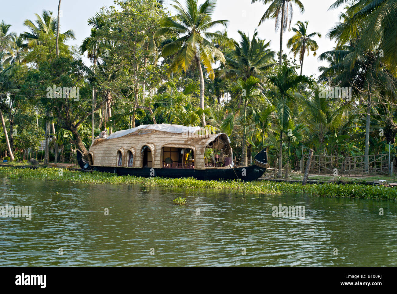 INDIA KERALA Renovated rice boat on canals in the backwaters of Kerala ...