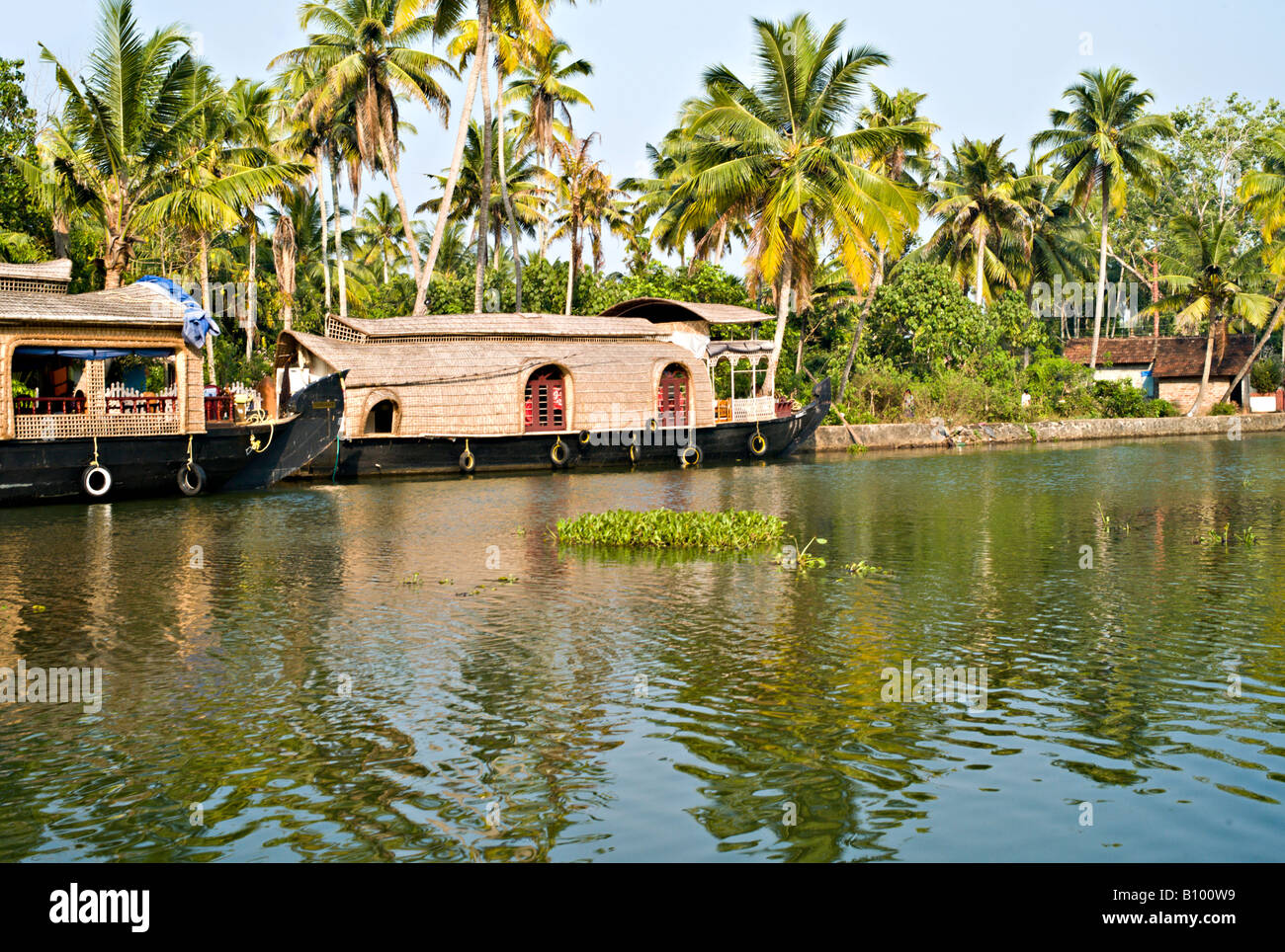 INDIA KERALA Renovated rice boat on canals in the backwaters of Kerala ...