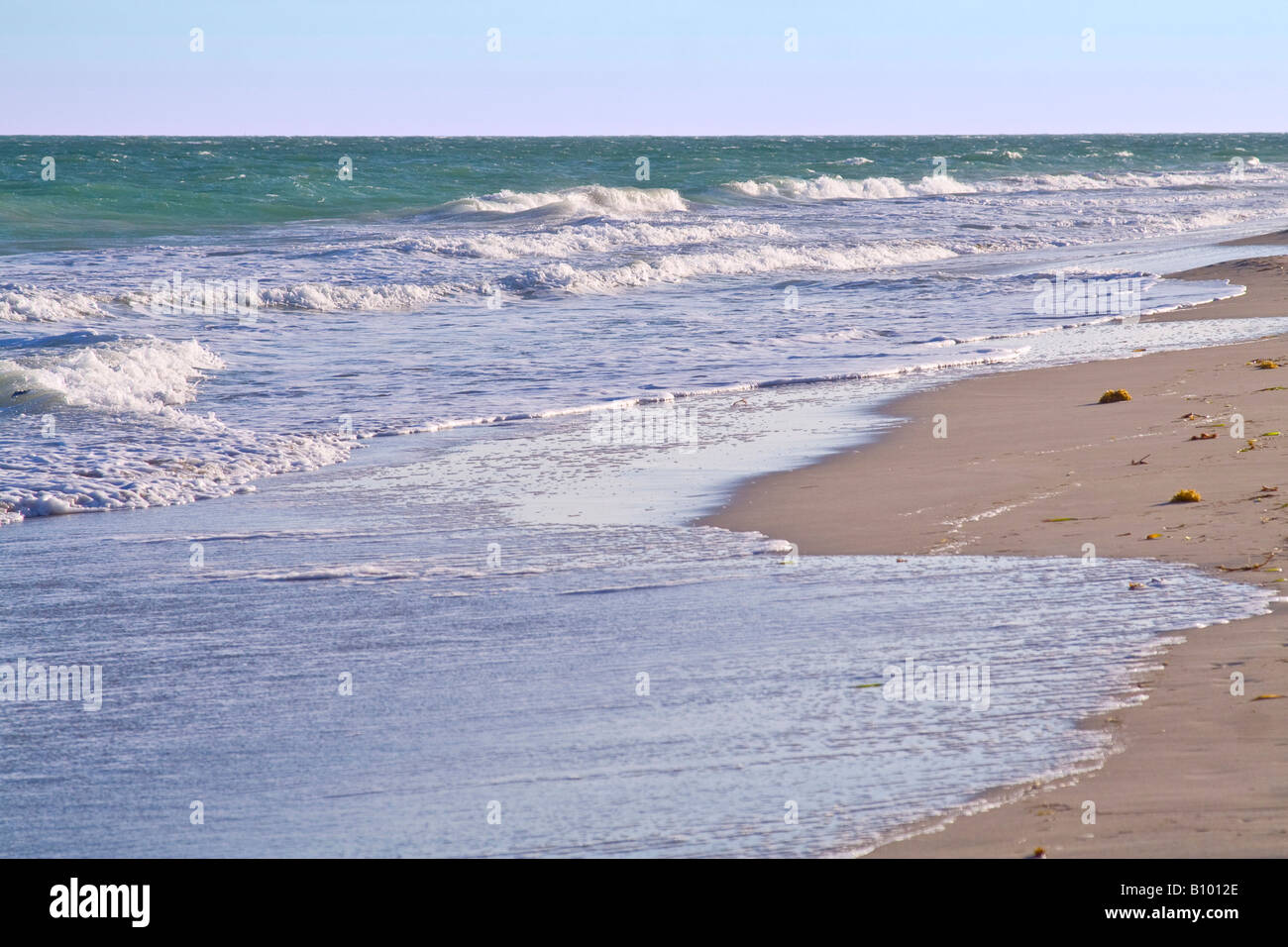 Ocean beach sunset in Cut Out Stock Images & Pictures - Alamy
