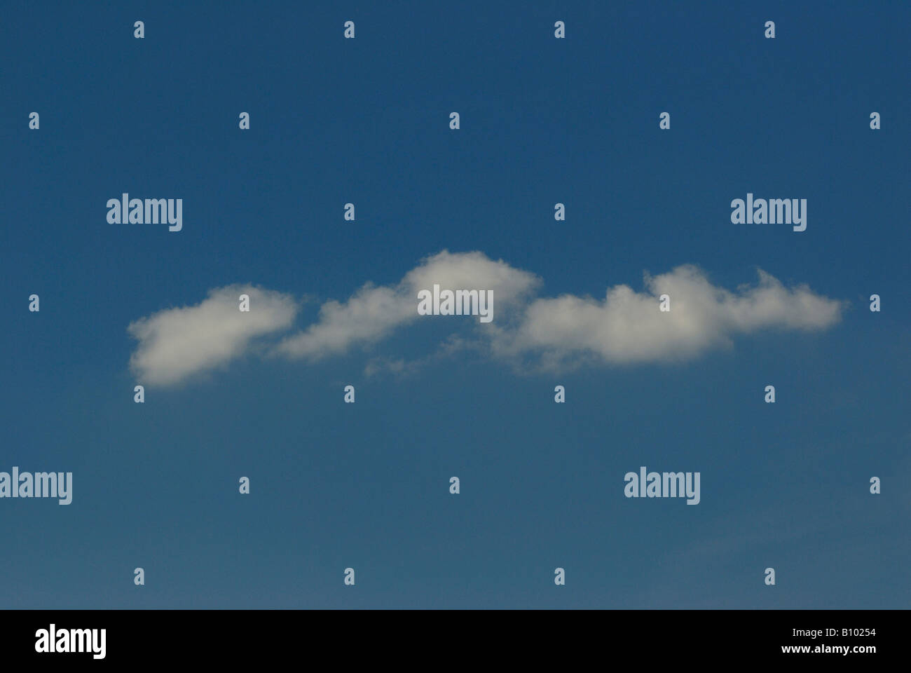 Three Clouds, blue sky Stock Photo - Alamy