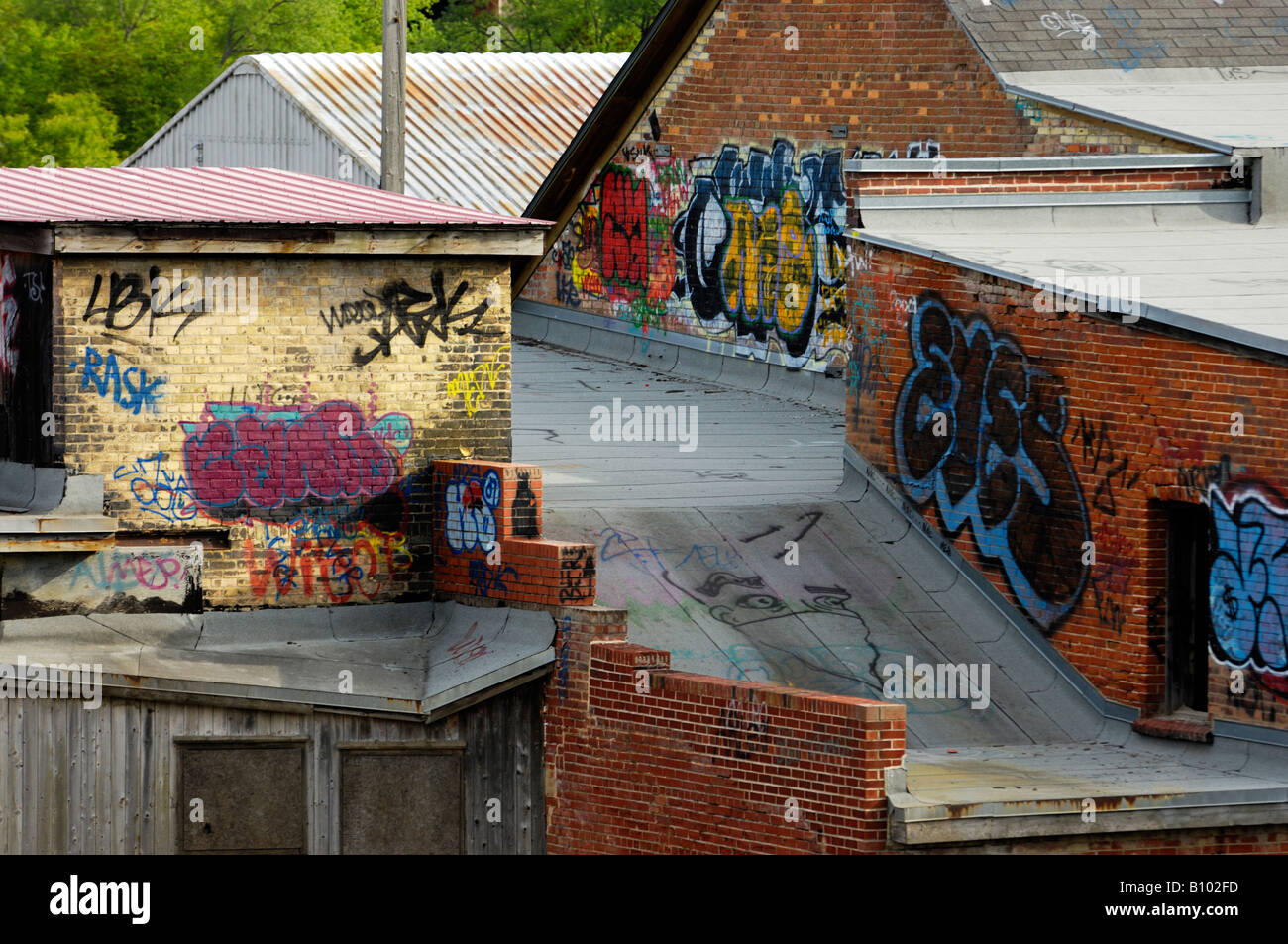 Graffiti on abandoned building roof Stock Photo - Alamy