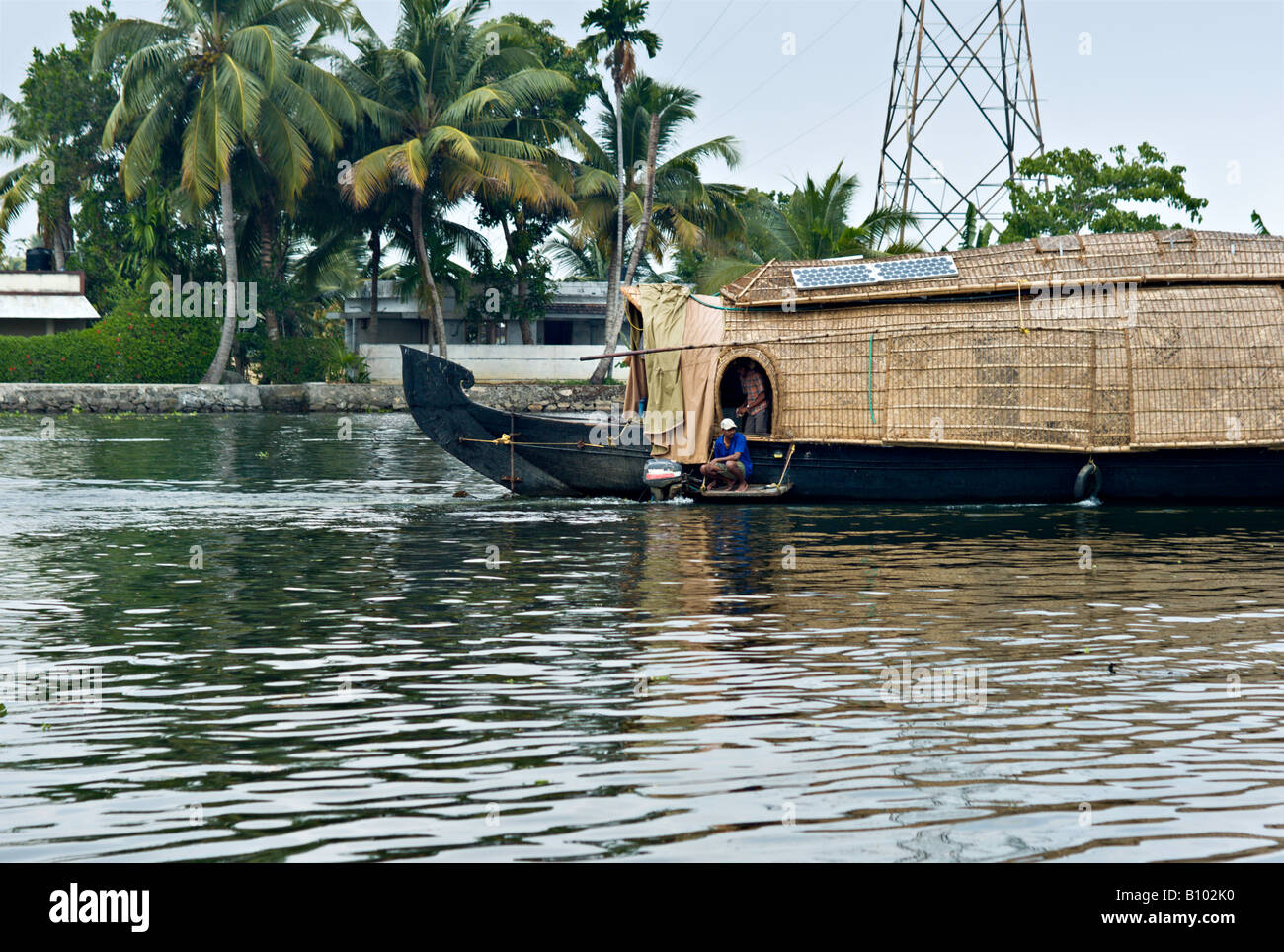 INDIA KERALA Renovated rice boat with solar panels on canals in the ...