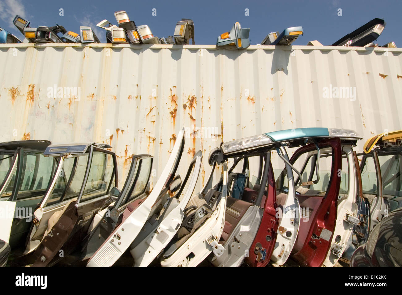 Smashed and crushed automobiles and parts in an Auto Salvage yard Stock ...
