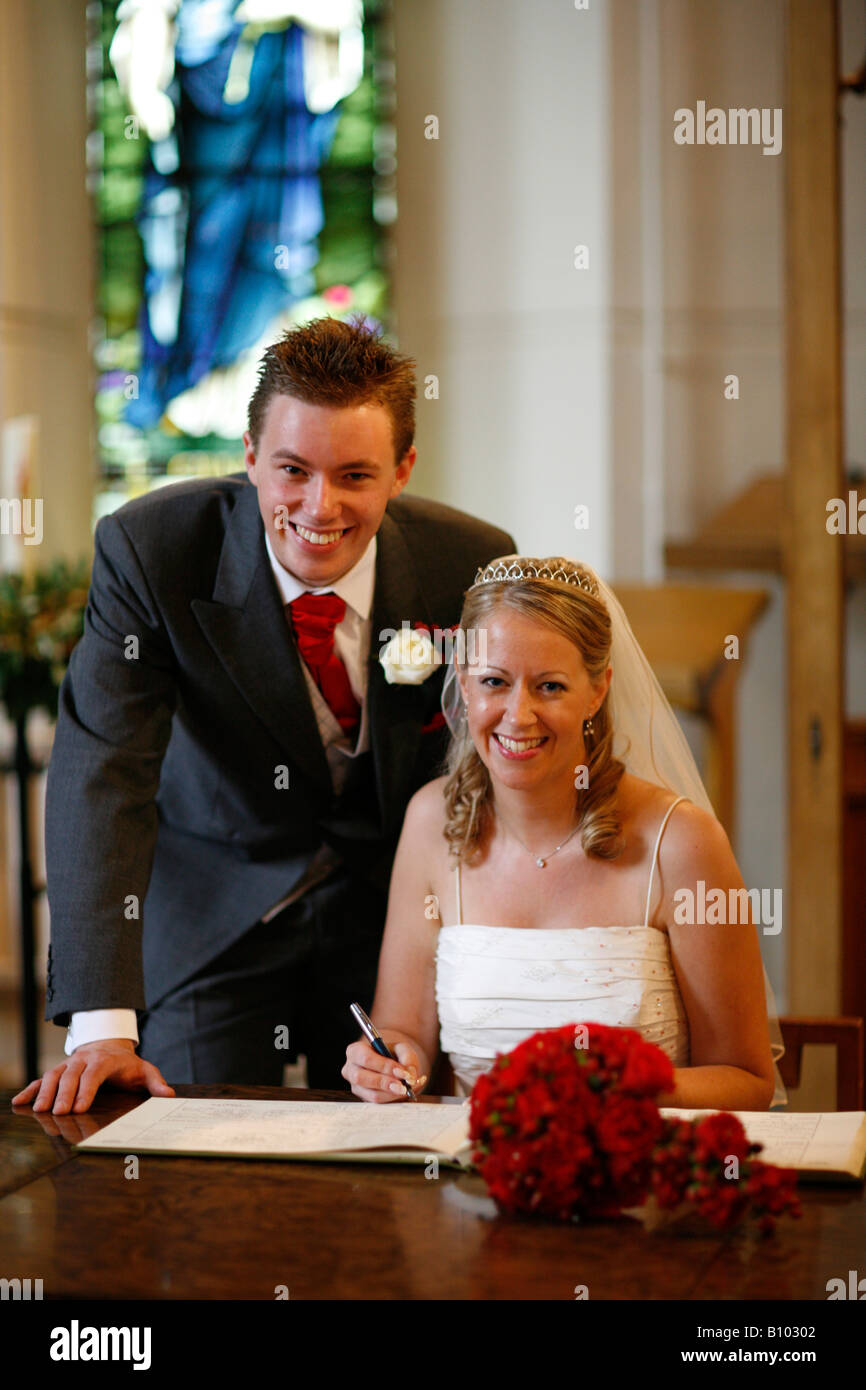 Bride and Groom signing marriage register Stock Photo - Alamy