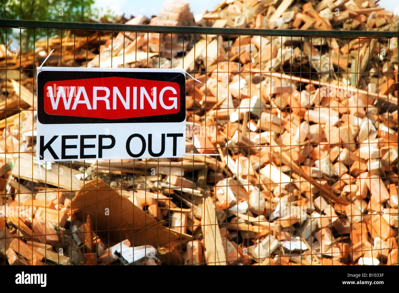 Demolished building site with a keep out sign Stock Photo - Alamy