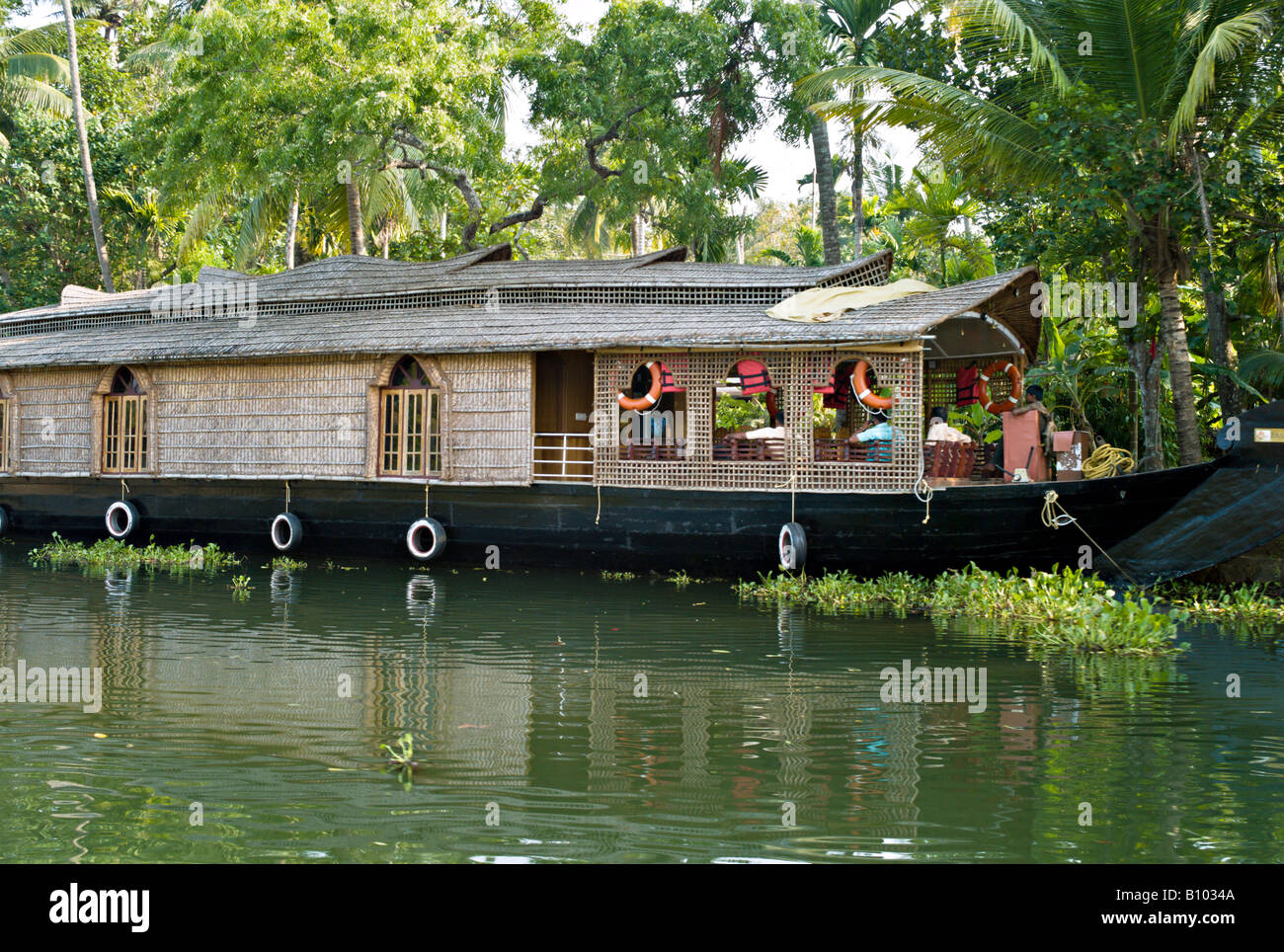 INDIA KERALA Renovated rice boat on canals in the backwaters of Kerala ...