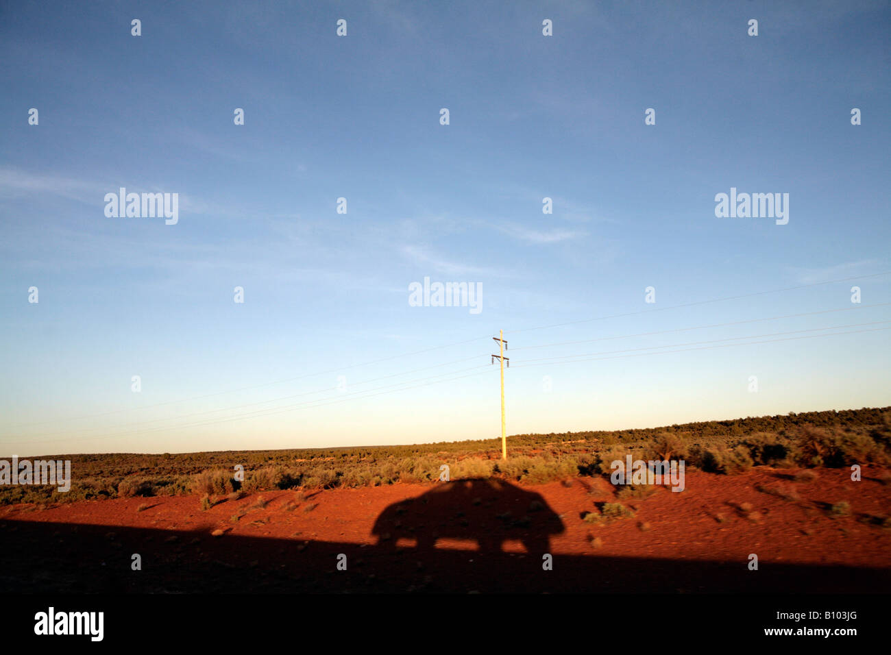 Shadow of a car driving through the desert, Arizona, USA Stock Photo ...