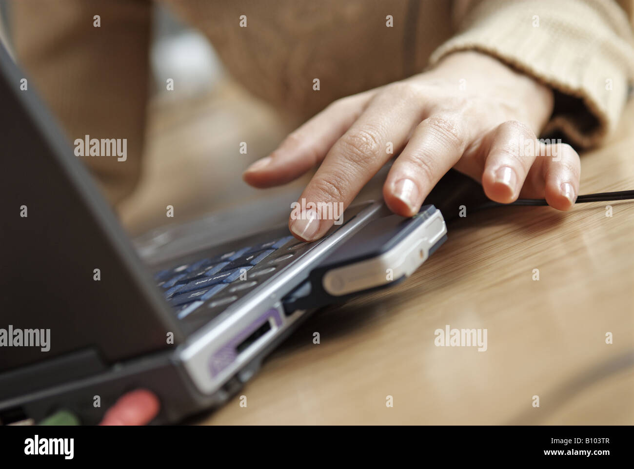 Close-up of a hand working on laptop Stock Photo - Alamy