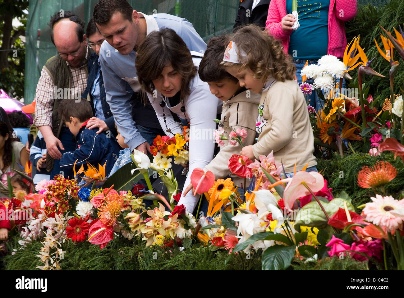 dh Flower Festival FUNCHAL MADEIRA Family on the Wall of Hope placing ...