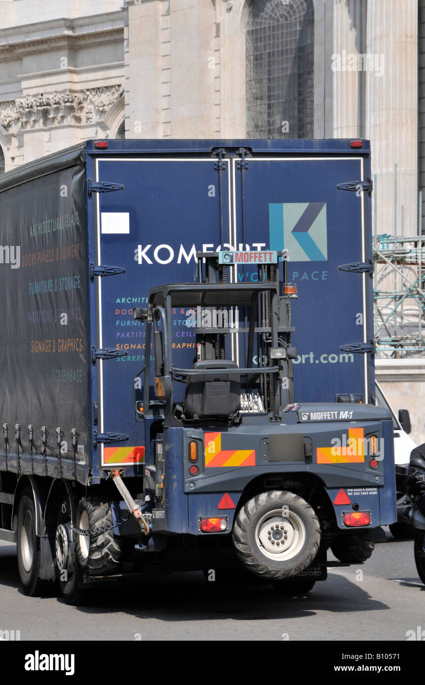 Back of large lorry fitted with its own rear mounted portable fork lift ...
