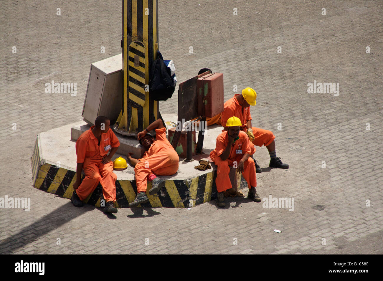 Dock workers waiting for work on the quayside at Mindelo, Såo Vicente ...