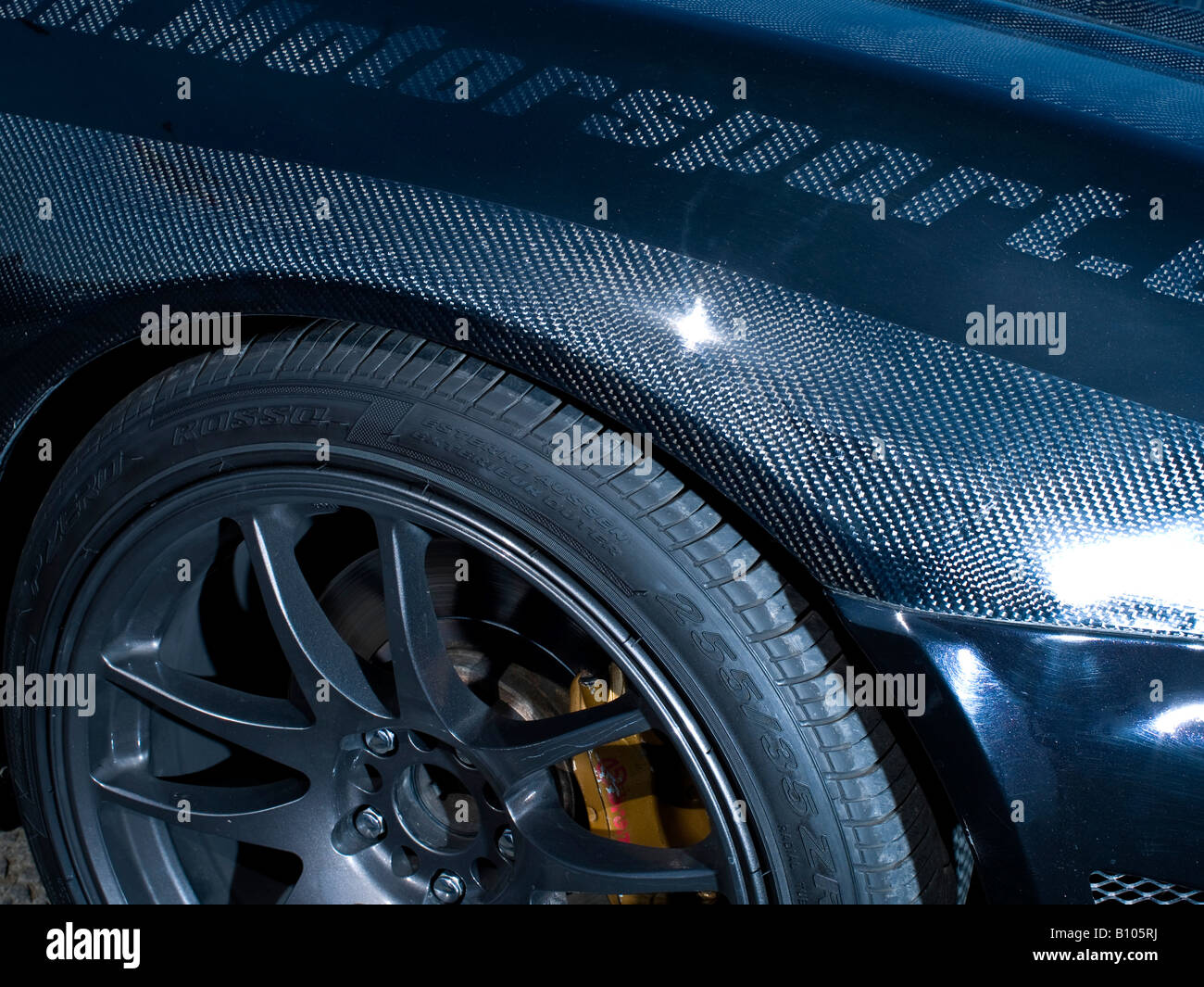 black wheel and carbon fibre bonnet hood on modified car Stock Photo ...