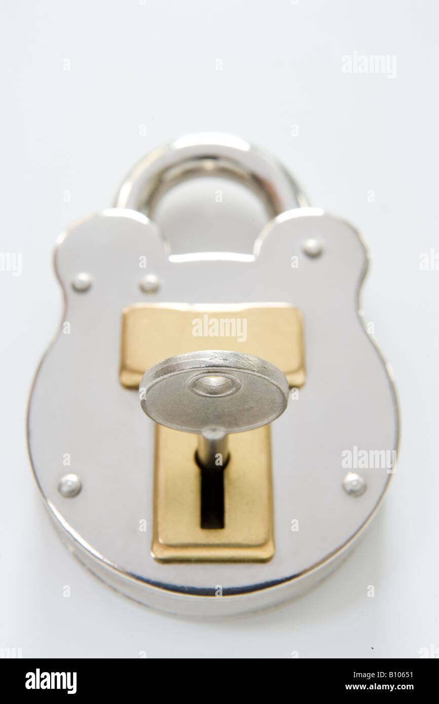 locked padlock with key and room for copy Stock Photo - Alamy