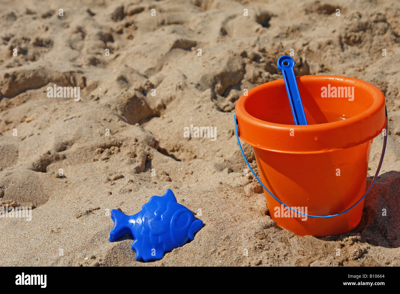 Child toy object at sand on the beach Stock Photo - Alamy