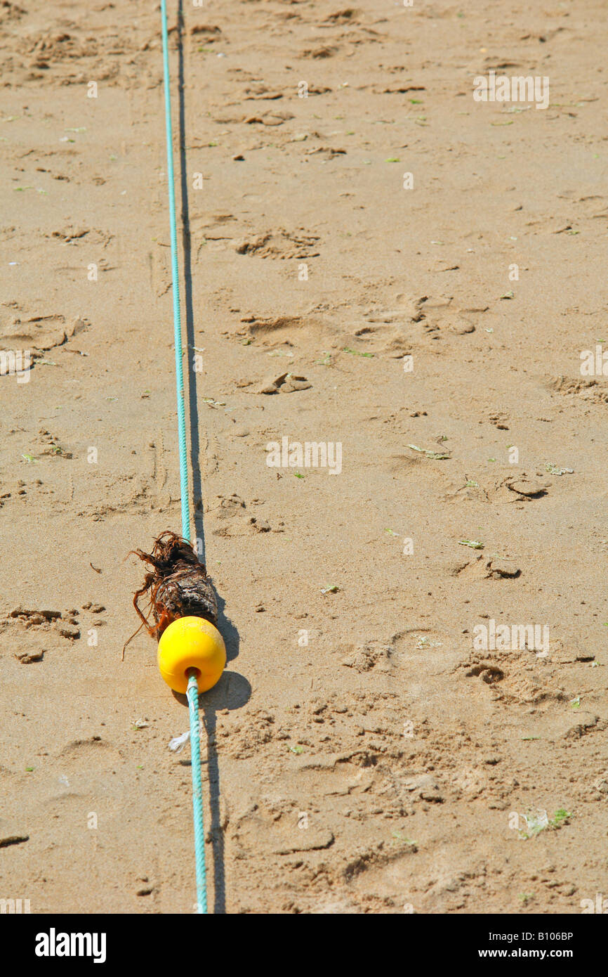 Rope at sand beach Stock Photo - Alamy
